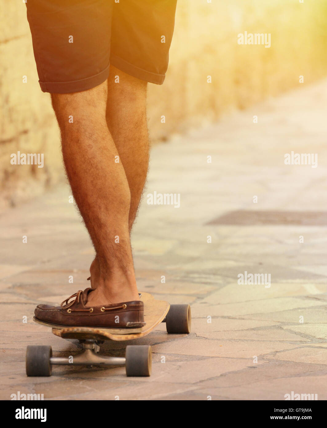 Motion blur of fast skateboarder feet moving Stock Photo - Alamy