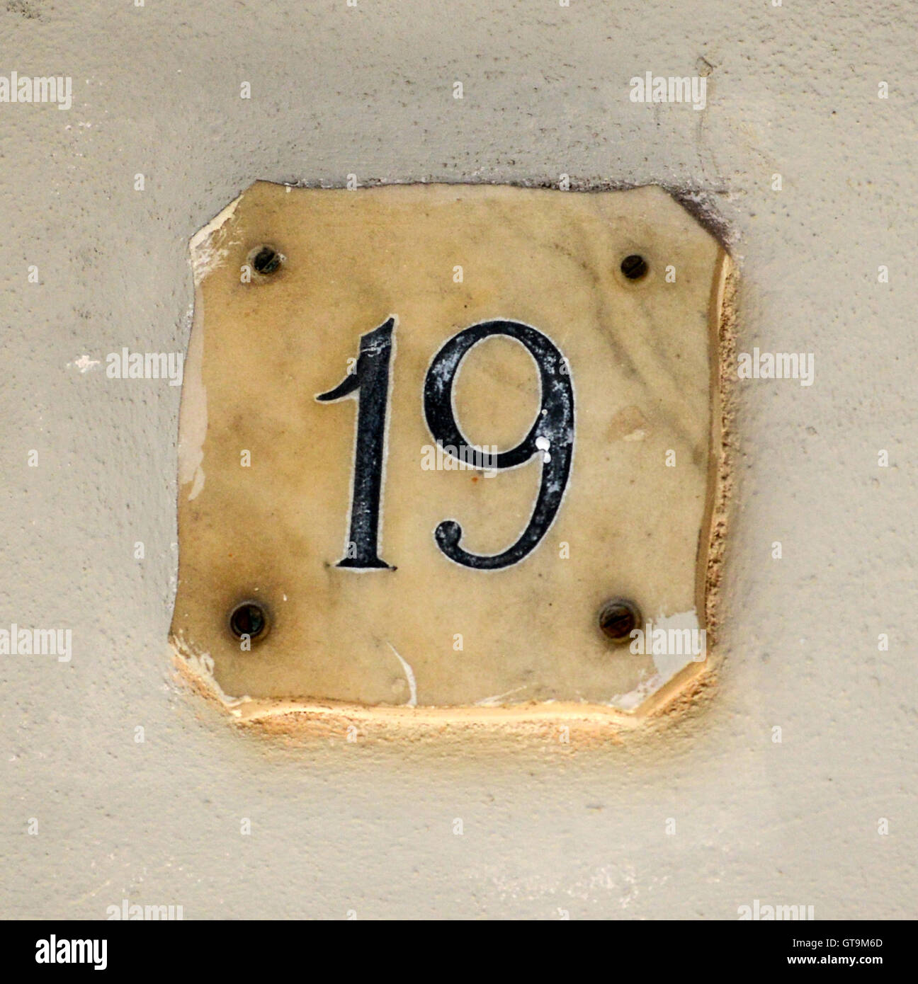 Number19 on house wall Stock Photo - Alamy
