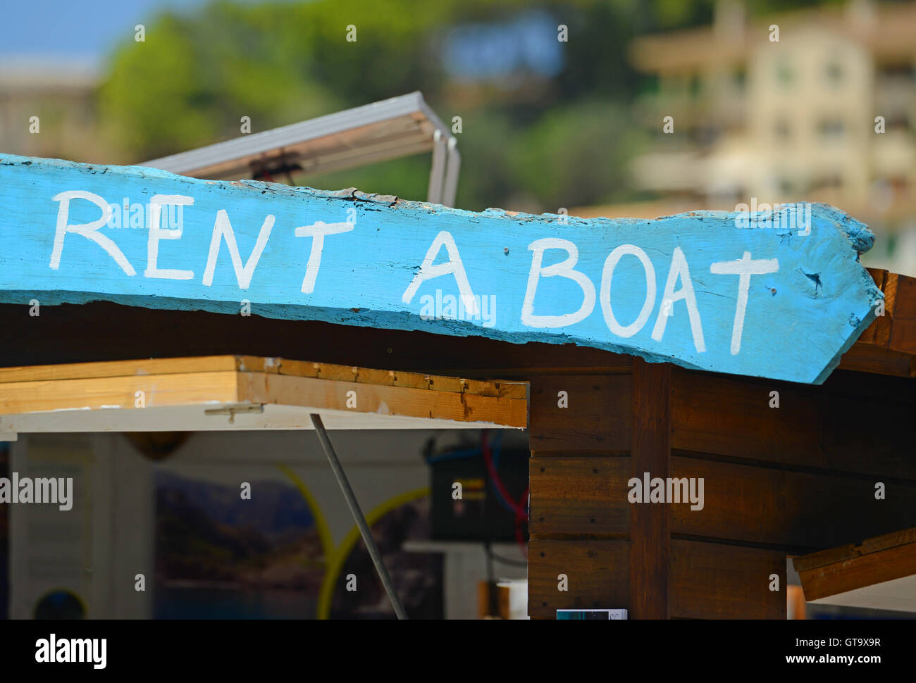 RENT A BOAT wooden sign Stock Photo - Alamy