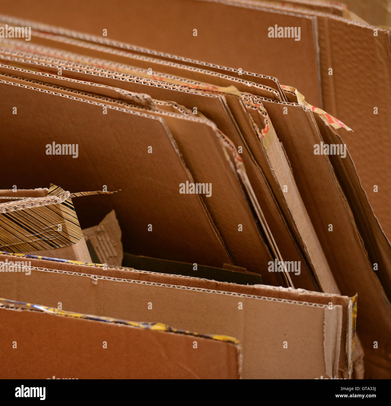 Stack of used cardboard ready for recycling Stock Photo - Alamy