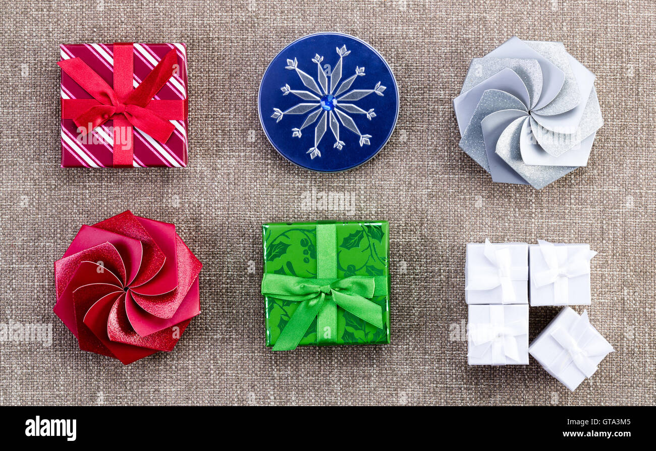 A selection of different Christmas gift boxes in red, blue, silver and ...