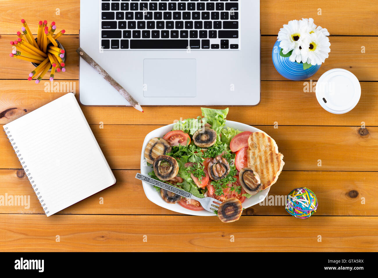 Overhead view of lunch break at the neatly organized desk along with ...