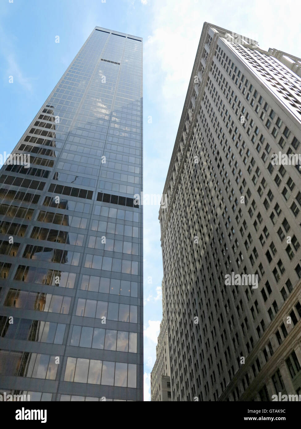 Looking up at two skyscrapers with blue sky Stock Photo - Alamy