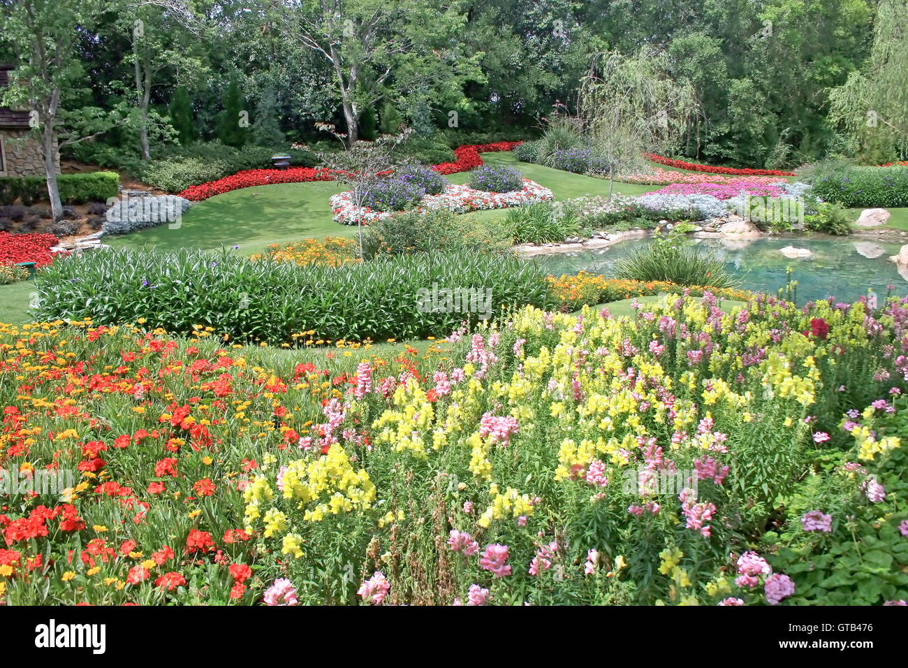 A beautiful garden with flowers and trees Stock Photo - Alamy
