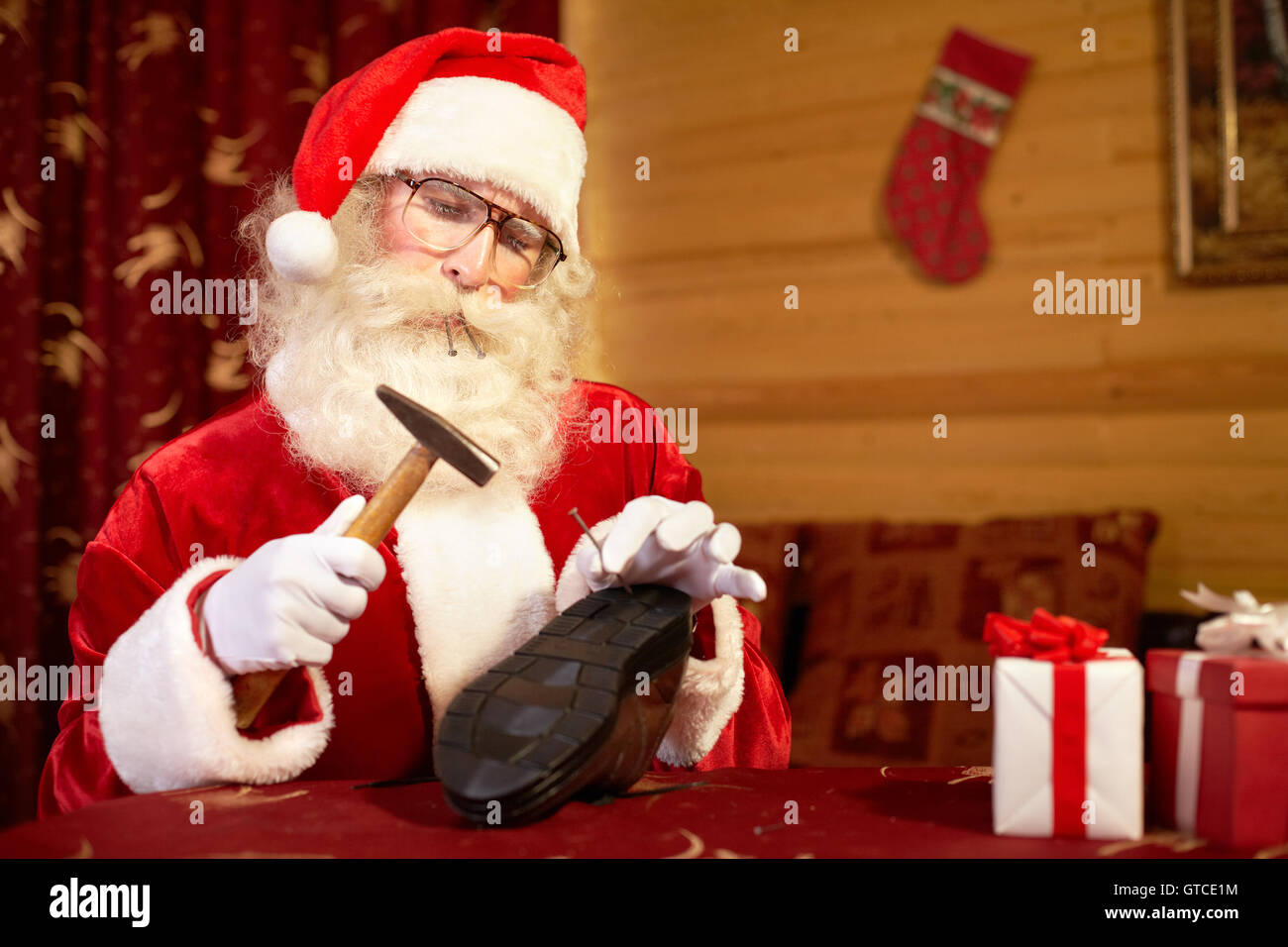 Santa Claus as a shoemaker Stock Photo - Alamy