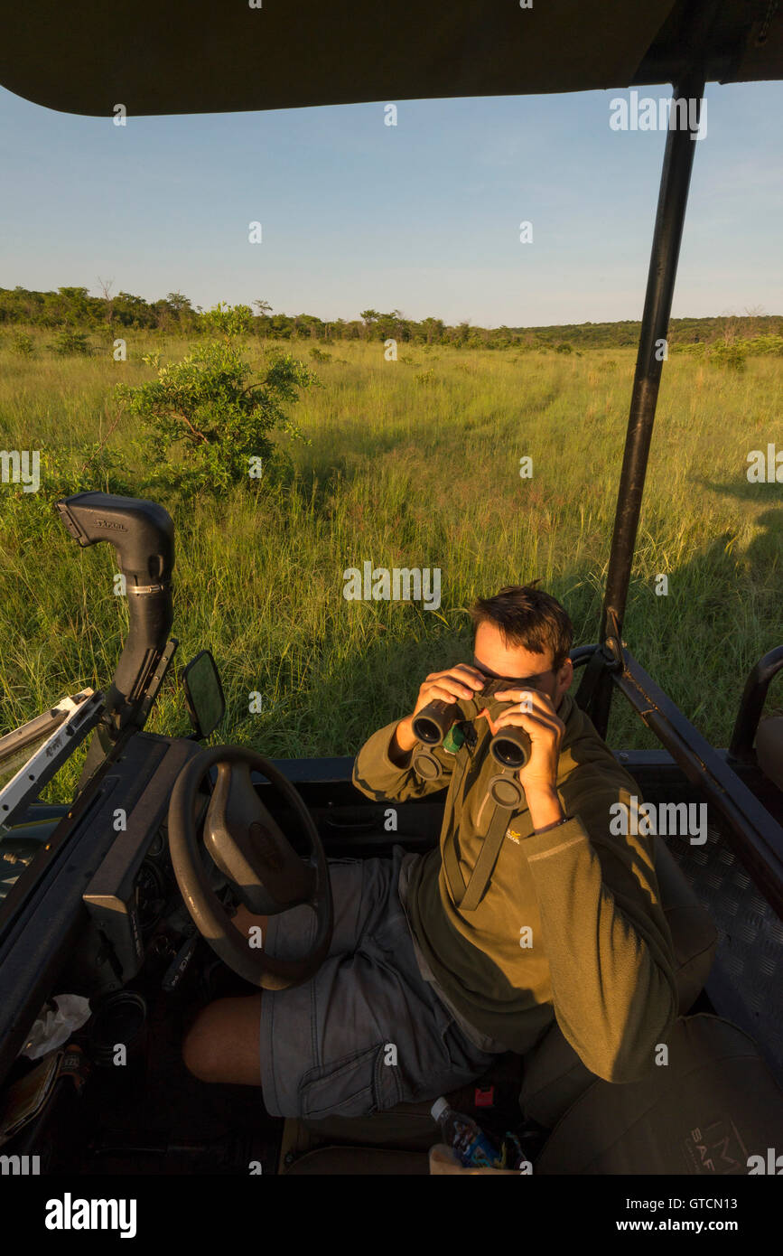A guide on an african safari in Zimbabwe Stock Photo - Alamy