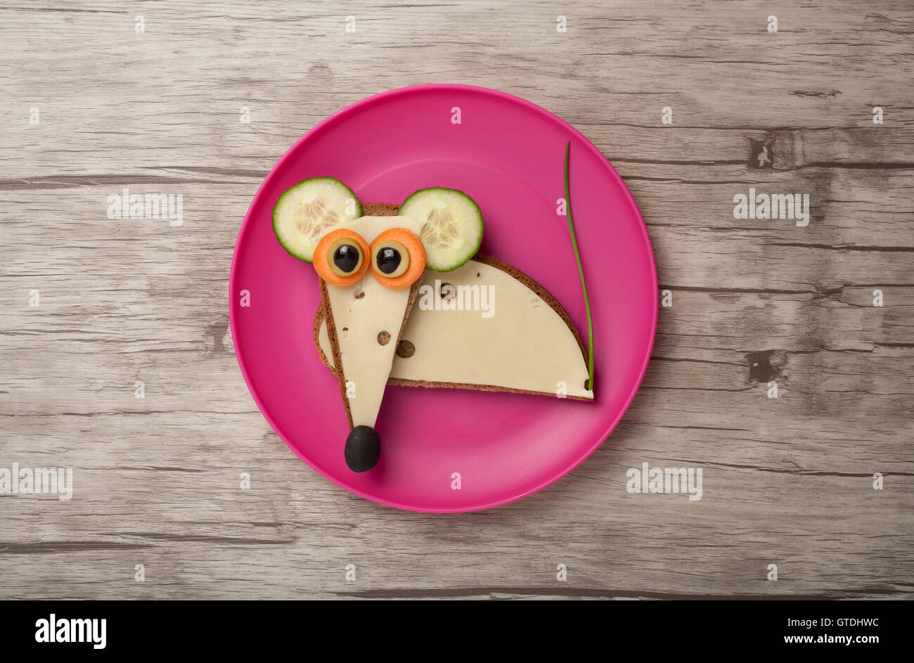 Funny sandwich mouse on plate and desk Stock Photo - Alamy