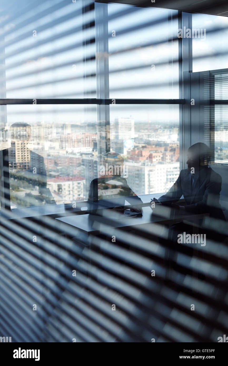 Meeting behind blinds Stock Photo - Alamy