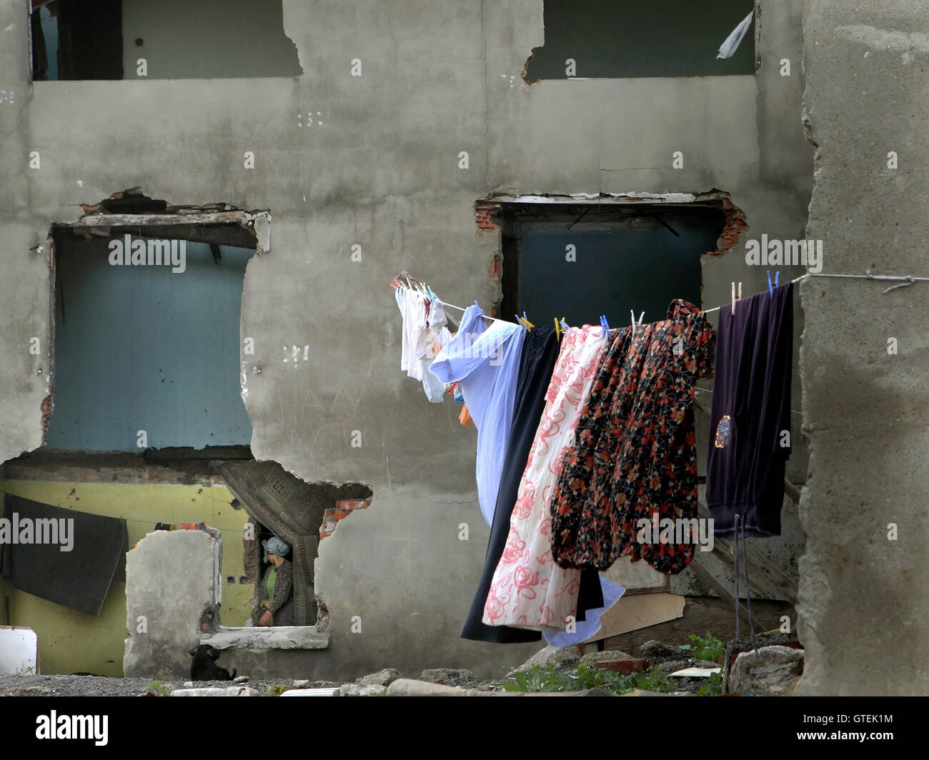 "Gypsy" Squatters in earthquake destroyed neighborhood. Clothes on line ...