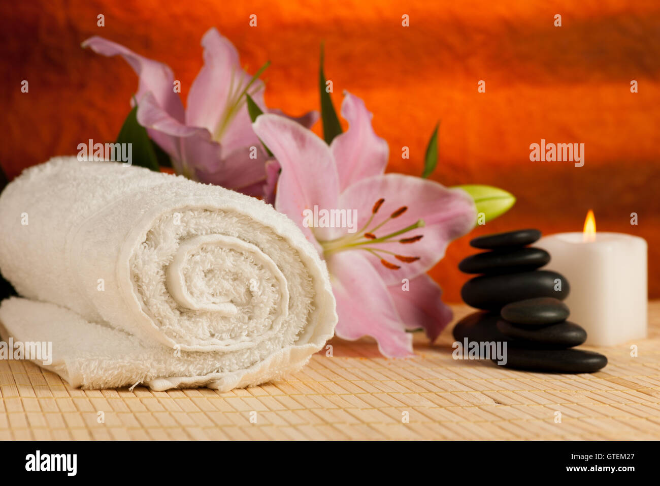 Spa Concept Of Lily Flower Towels Sea Salt Candle And Crystal Rock