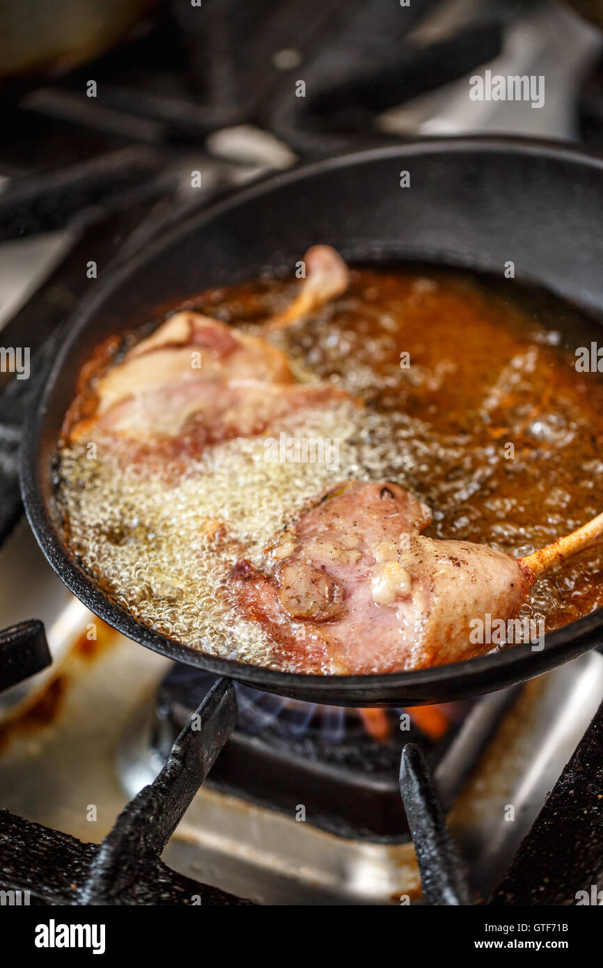 Duck leg roasted in a pan Stock Photo - Alamy
