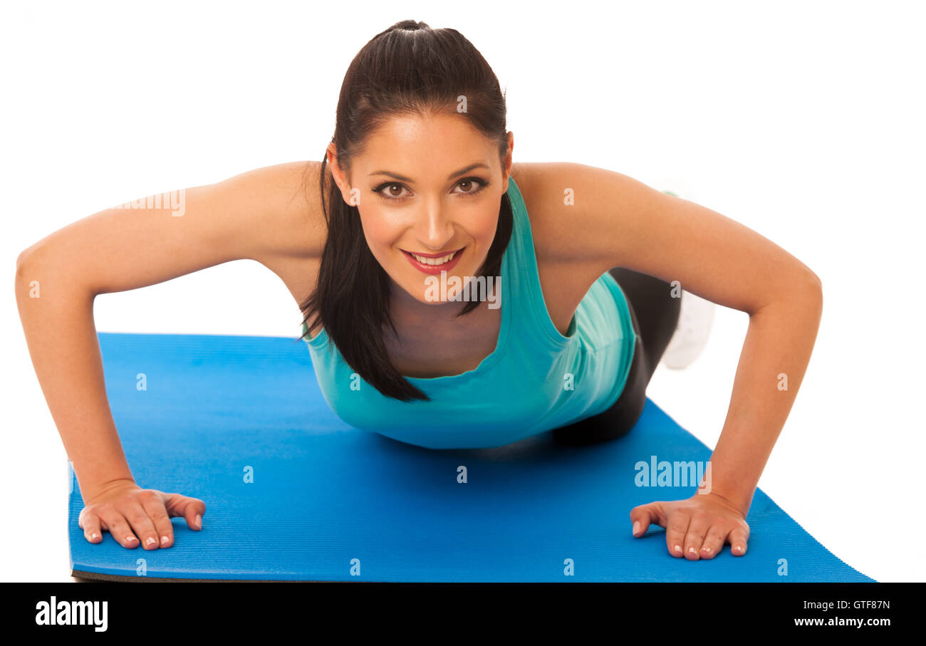Woman making pushups isolated over white background Stock Photo - Alamy