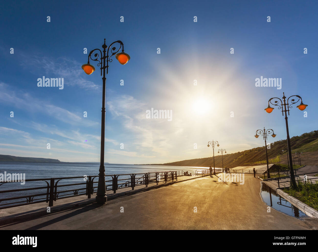Street lights on the promenade of great river Stock Photo - Alamy