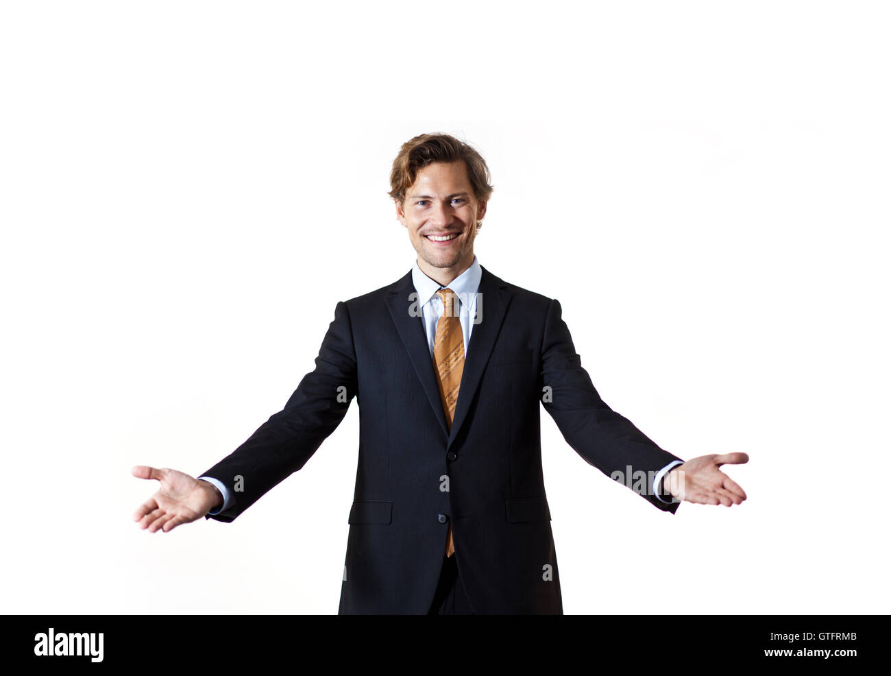 Smiling businessman saying welcome Stock Photo - Alamy