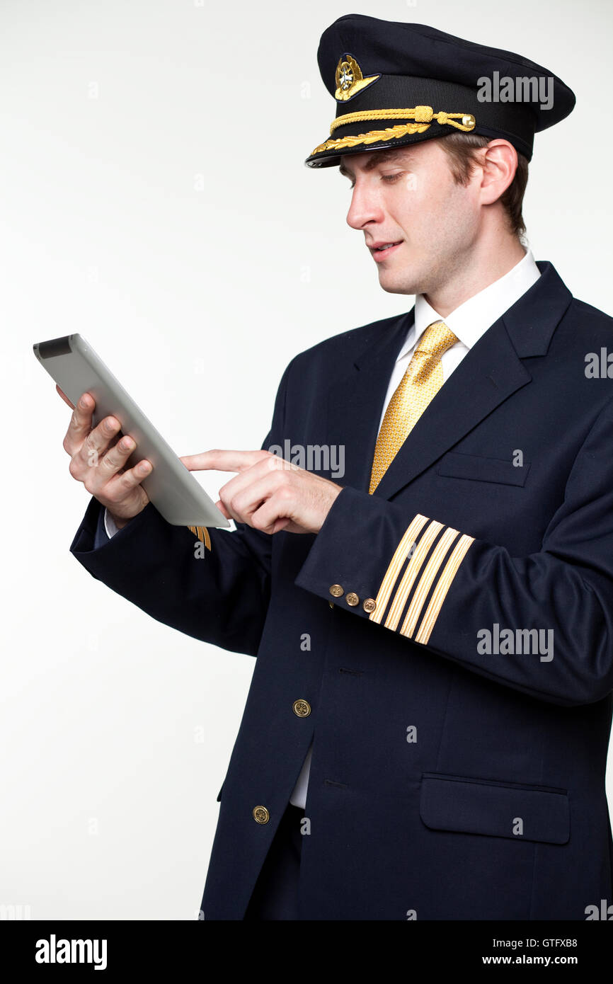 Young man in the form of a passenger plane pilot Stock Photo - Alamy