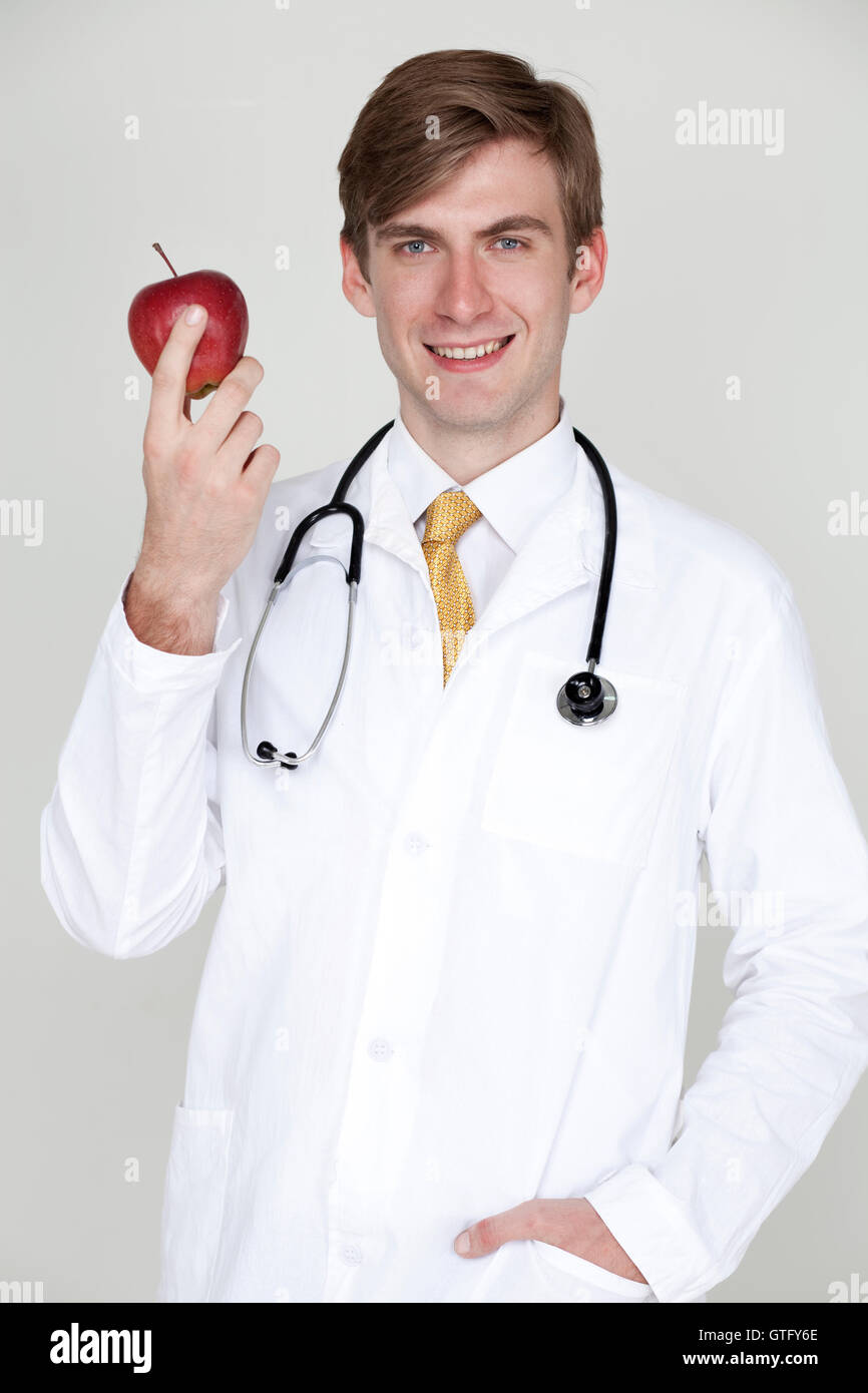 One apple a day and doctor away Stock Photo - Alamy