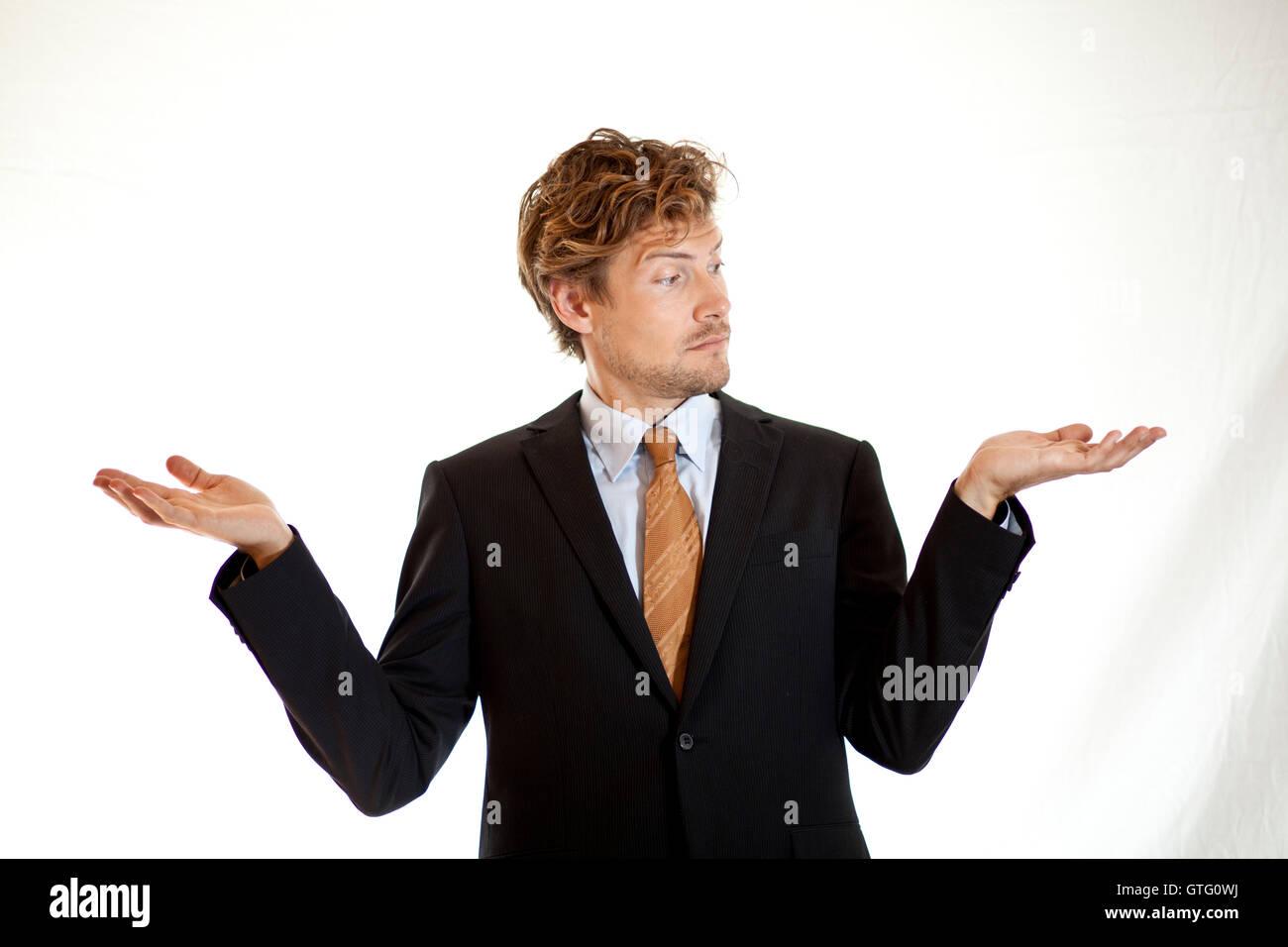 Businessman showing off two ideas Stock Photo - Alamy