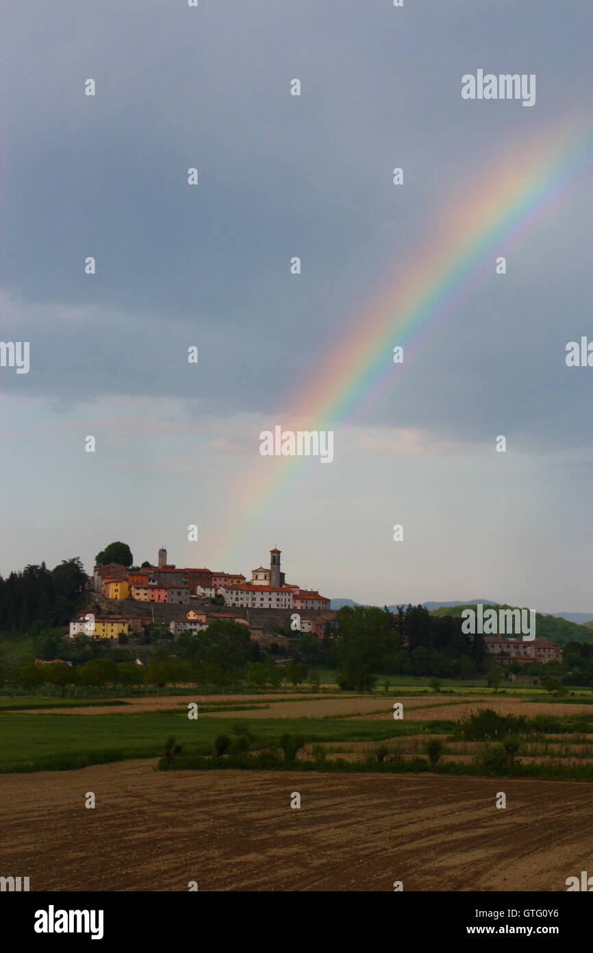 A rainbow ends over Monterchi, Tuscany Stock Photo - Alamy