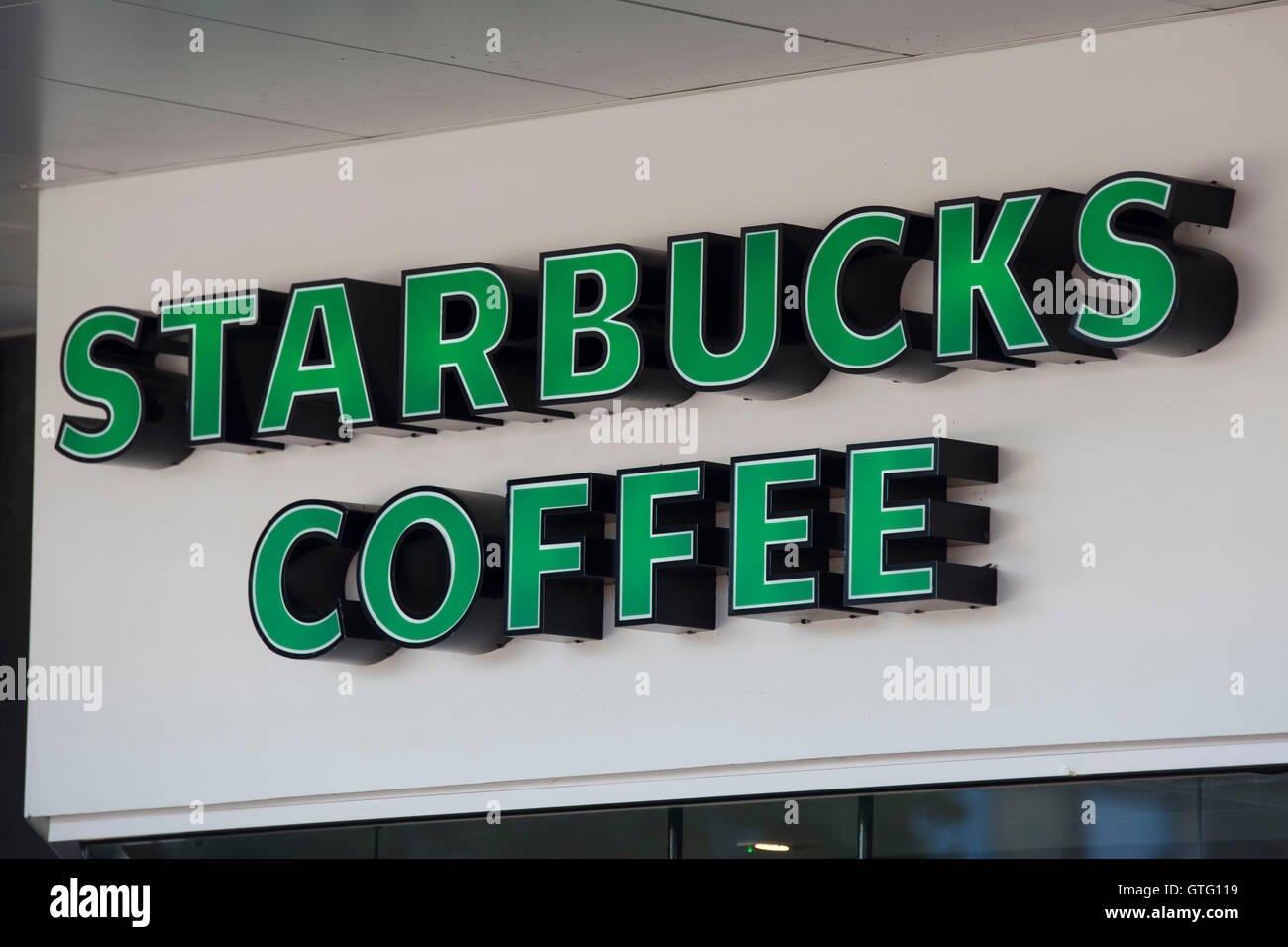 Starbucks coffee shop sign logo Stock Photo - Alamy
