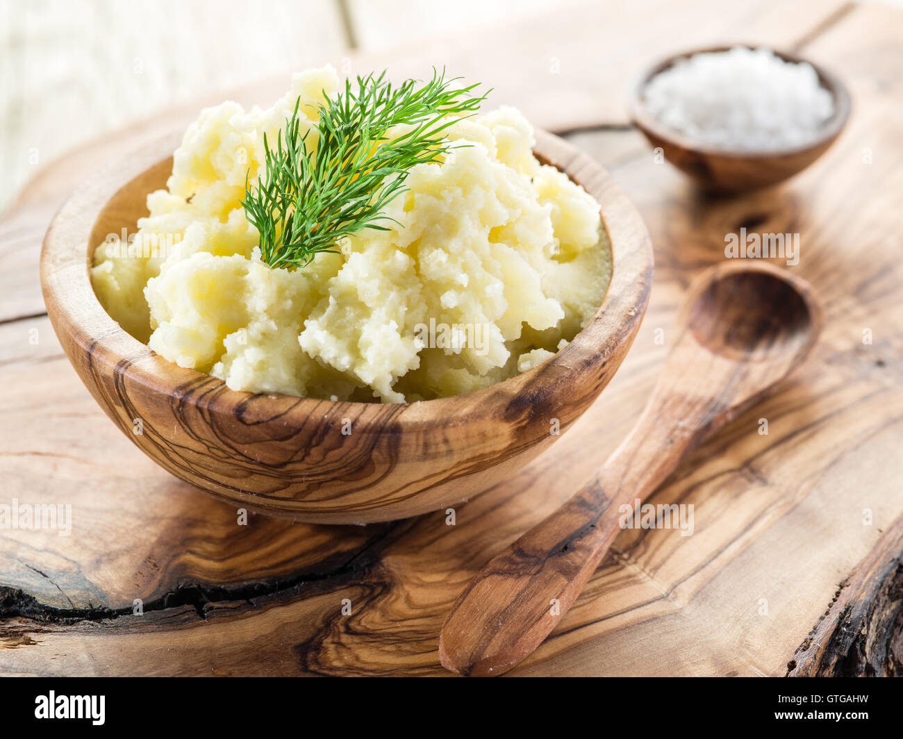 Mashed potatoes in the wooden bowl on the service tray Stock Photo - Alamy