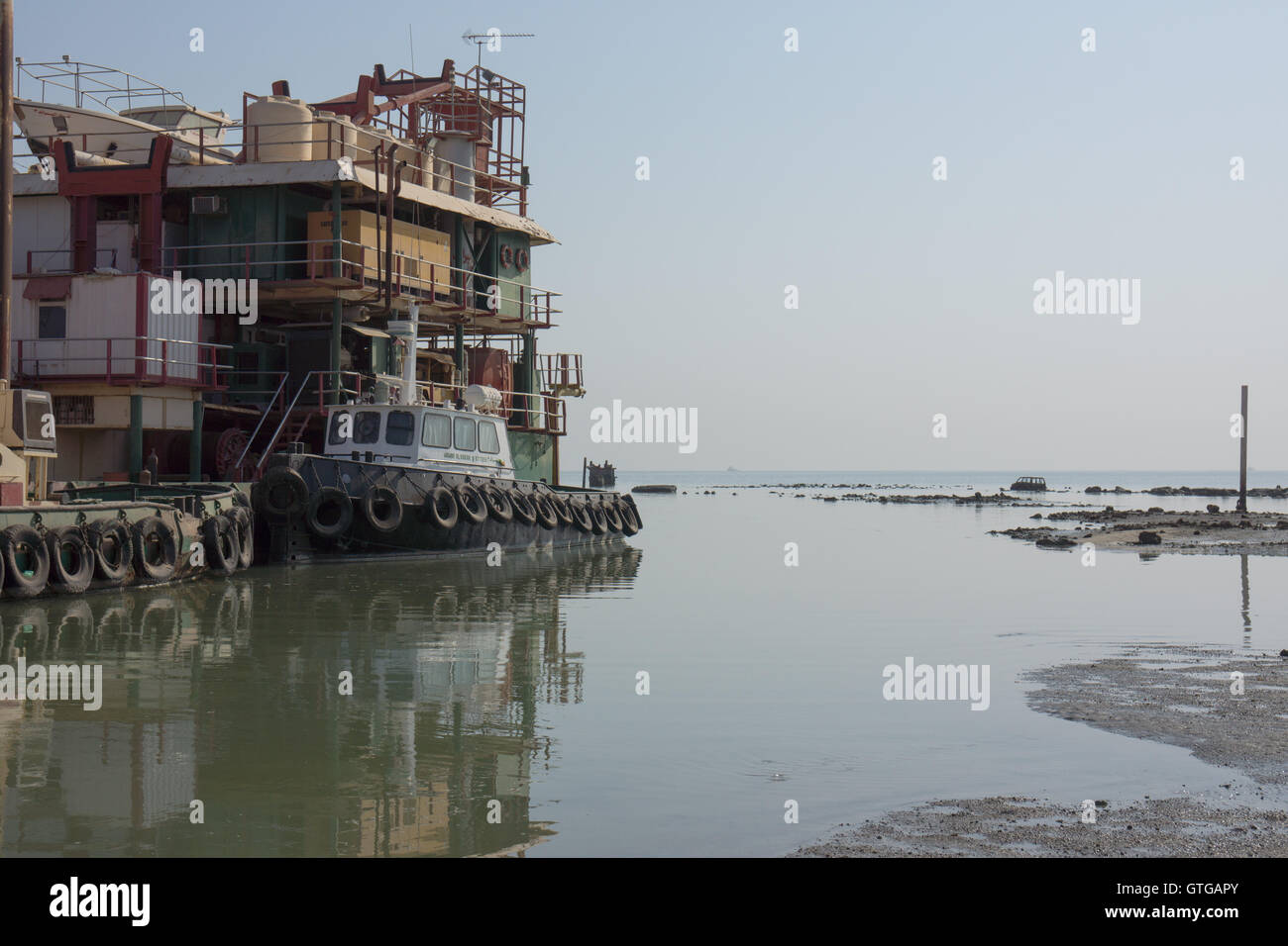 Tug boat moored in Kuwait Stock Photo - Alamy
