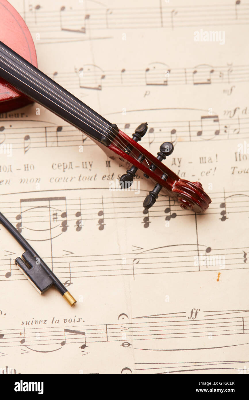 violoncello on of notes background Stock Photo - Alamy