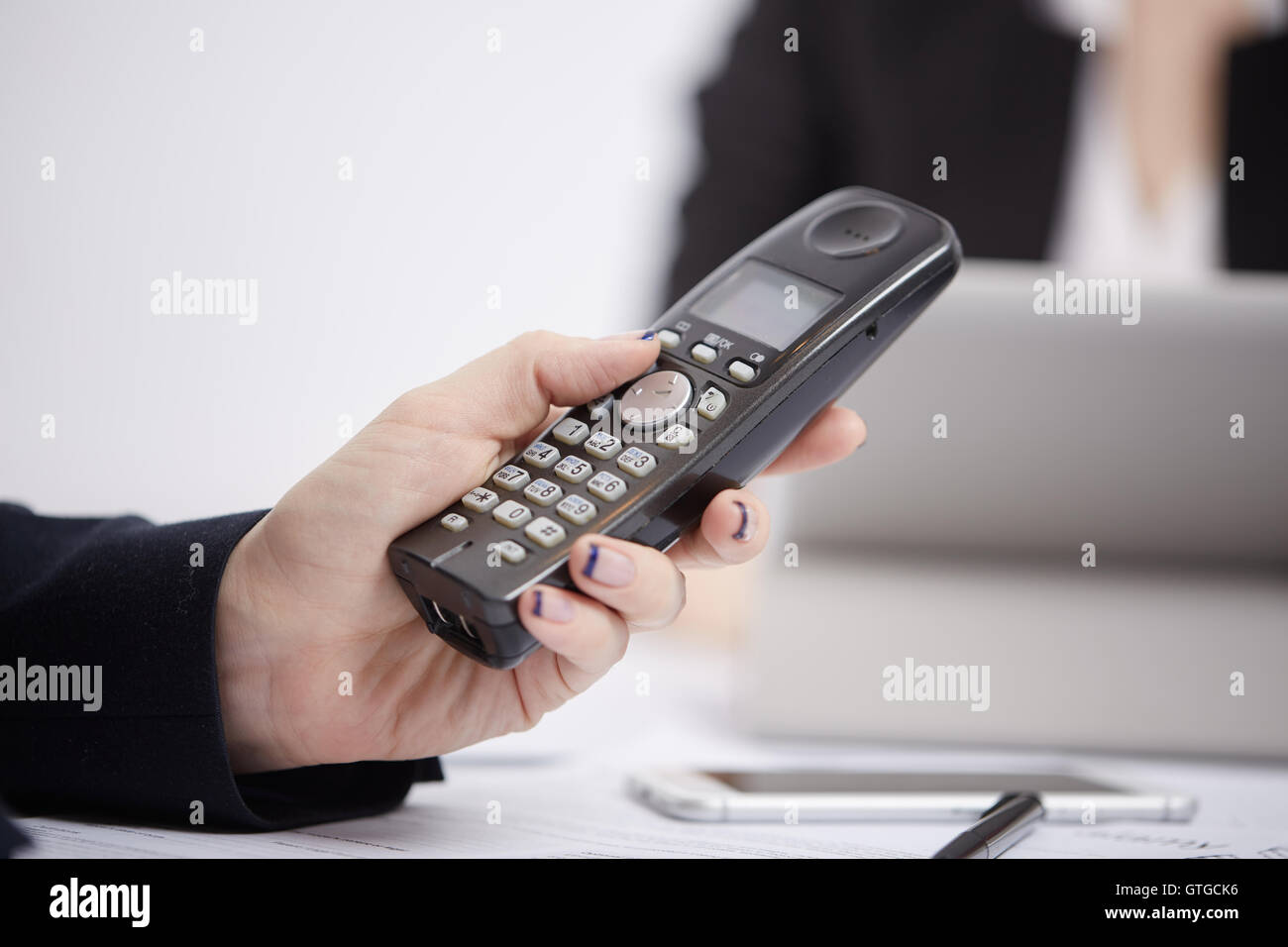 Radio phone in female hands Stock Photo - Alamy