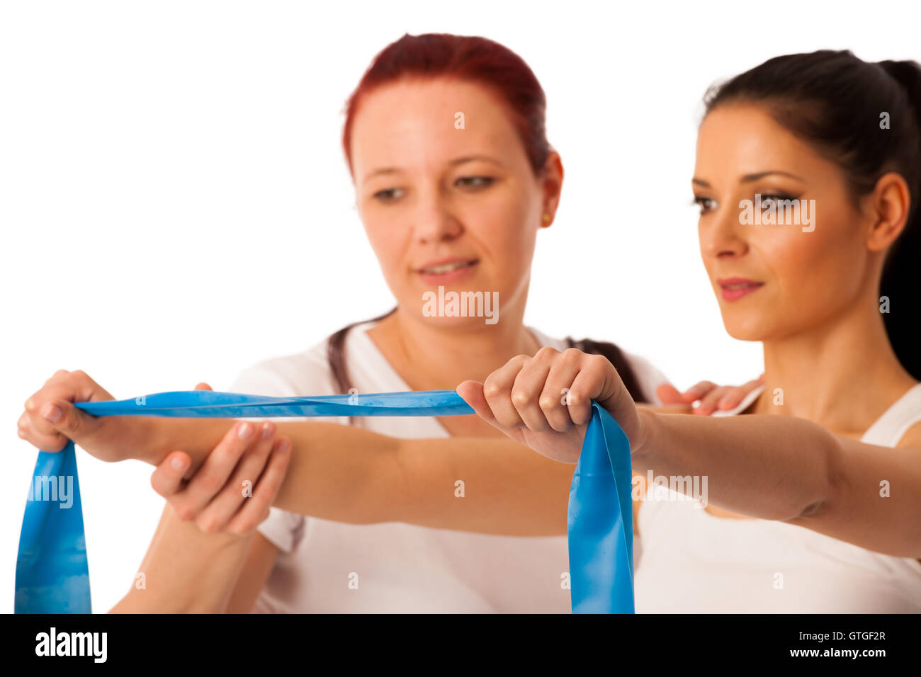 Physiotherapy - therapist doing arm straightening exercises with a ...