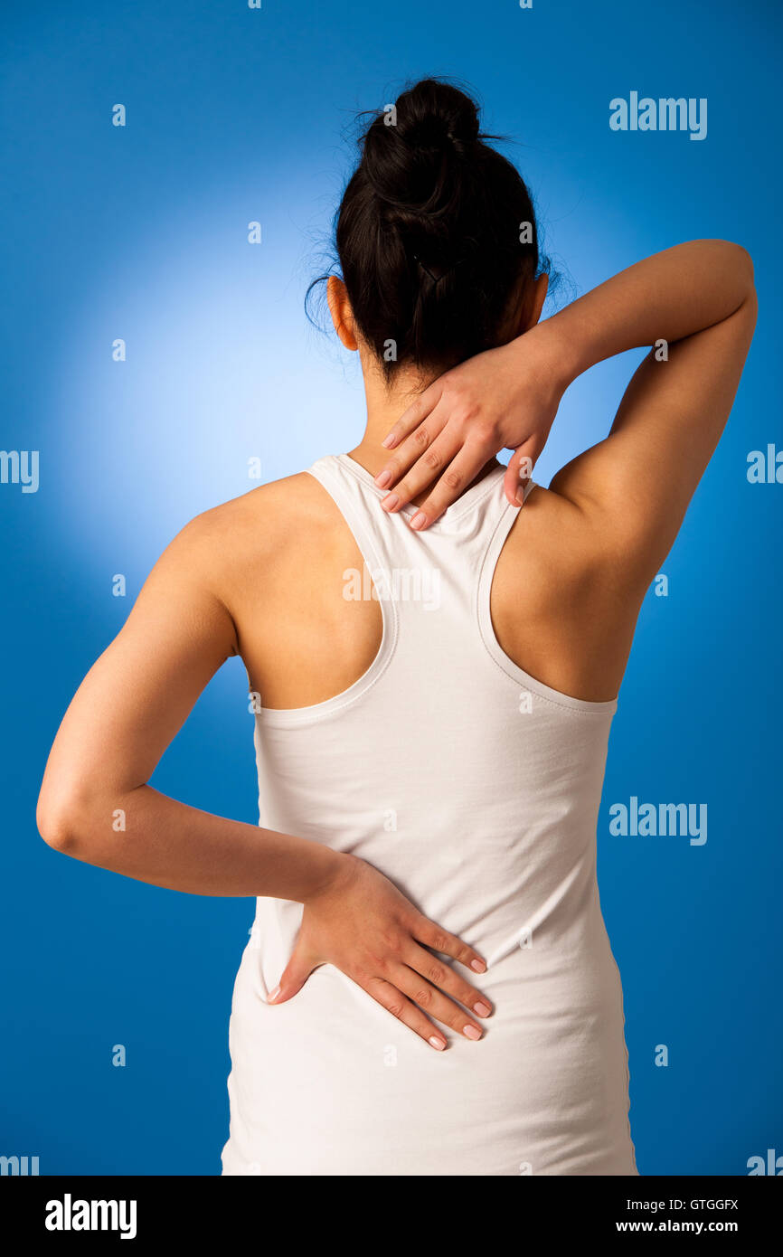 Woman having pain in her back - back injury Stock Photo - Alamy