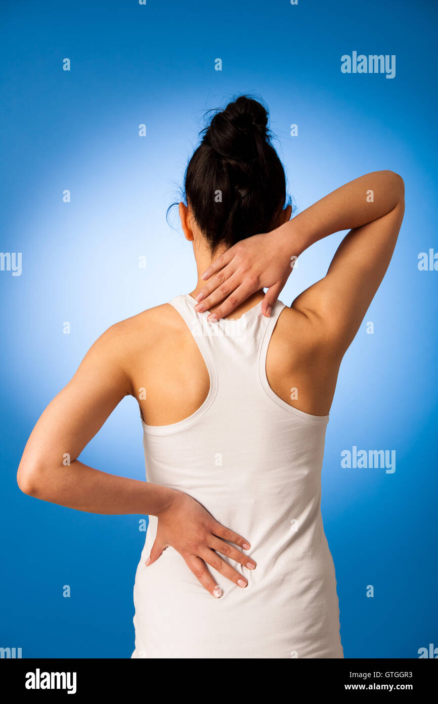 Woman having pain in her back - back injury Stock Photo - Alamy