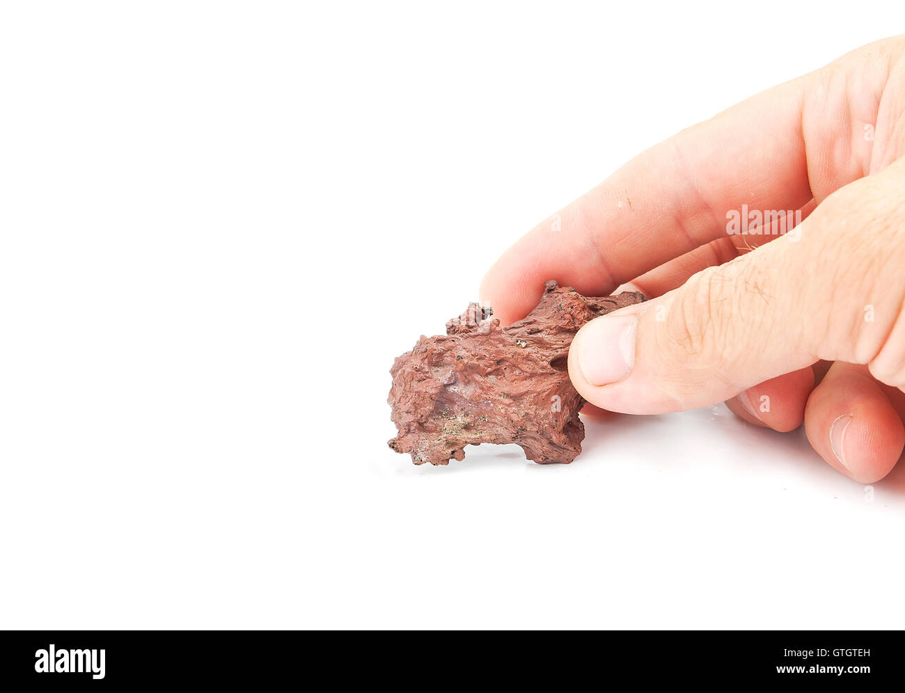 volcanic lava in hand isolated on a white background Stock Photo - Alamy