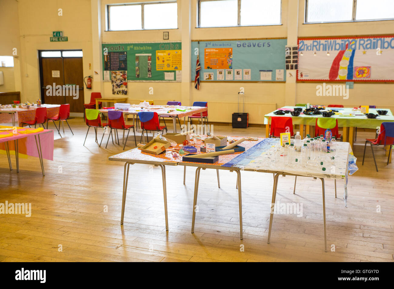 Interior of a church hall set up for activites with tables and chairs ...