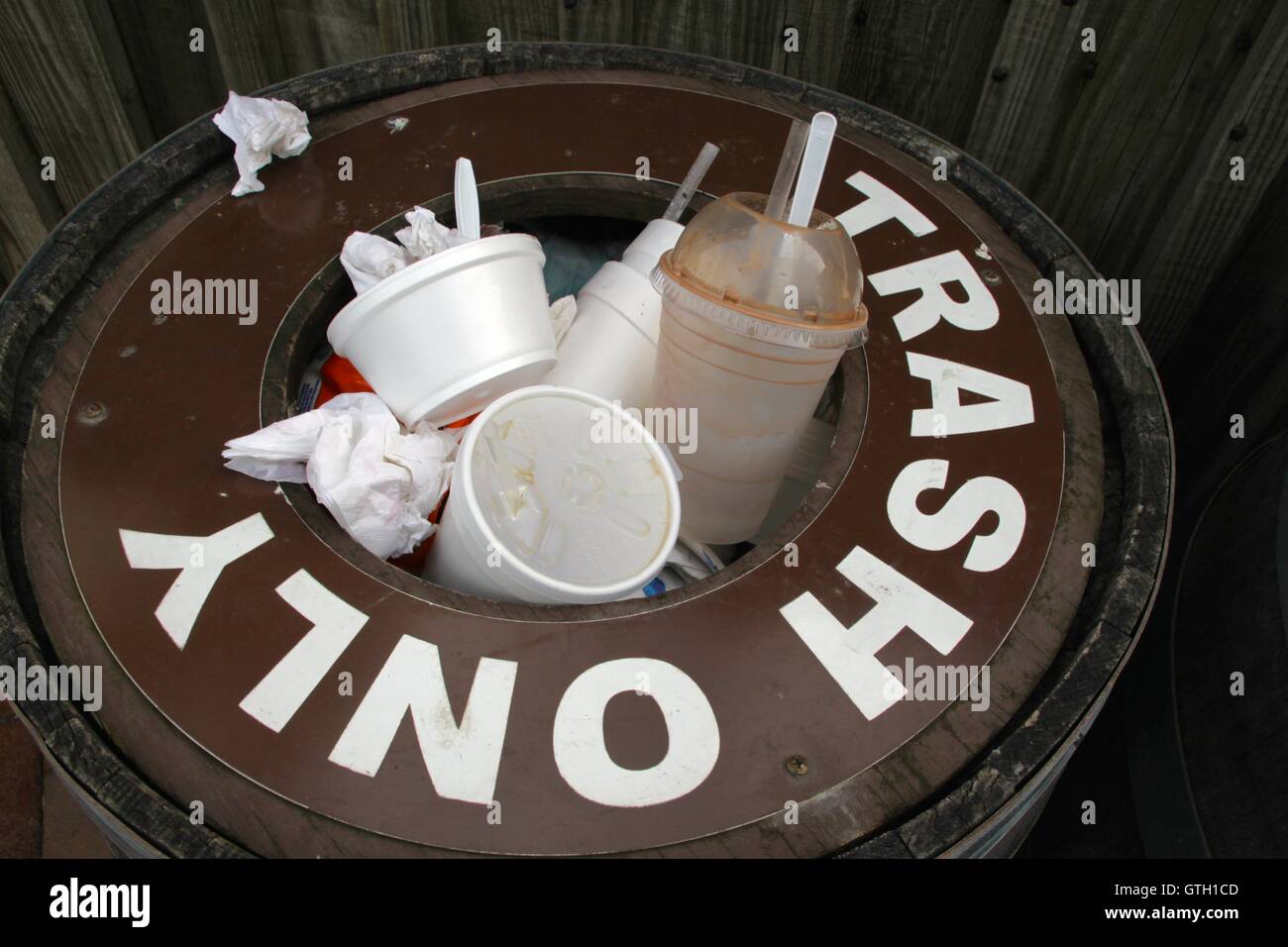 Put trash into trash can hi-res stock photography and images - Alamy