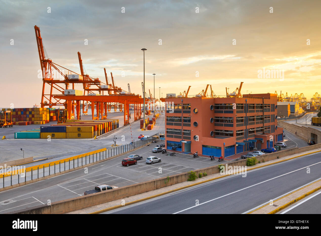 Container port of Piraeus at sunset Stock Photo - Alamy