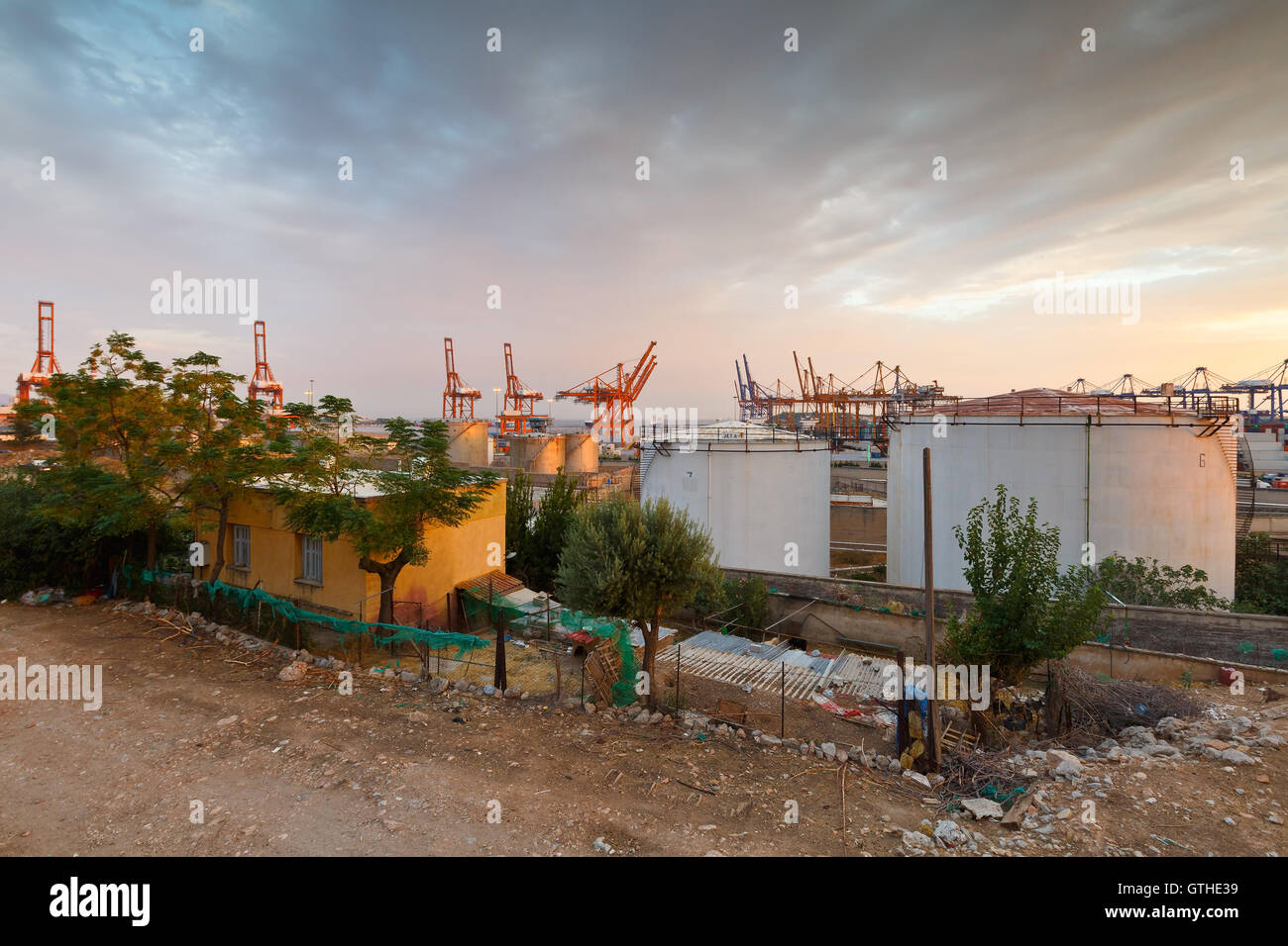 Container port of Piraeus at sunset Stock Photo - Alamy