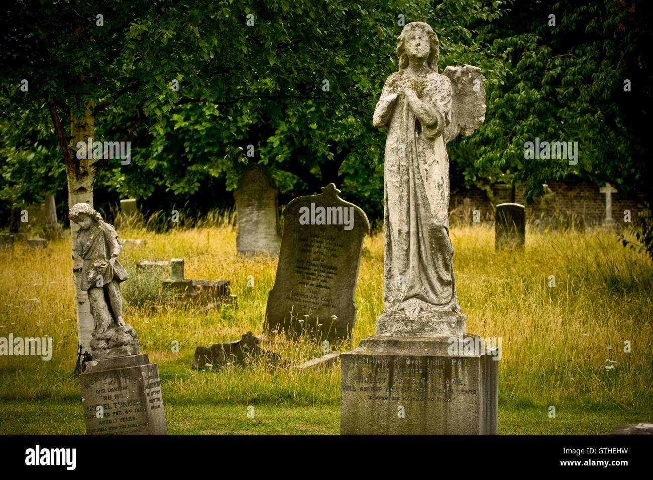 Old cemetery angel sculpture made of stone Stock Photo - Alamy