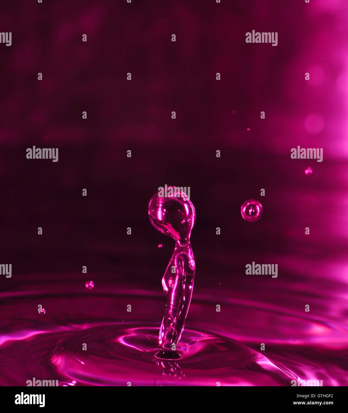 Pink figure in the water drops Stock Photo - Alamy