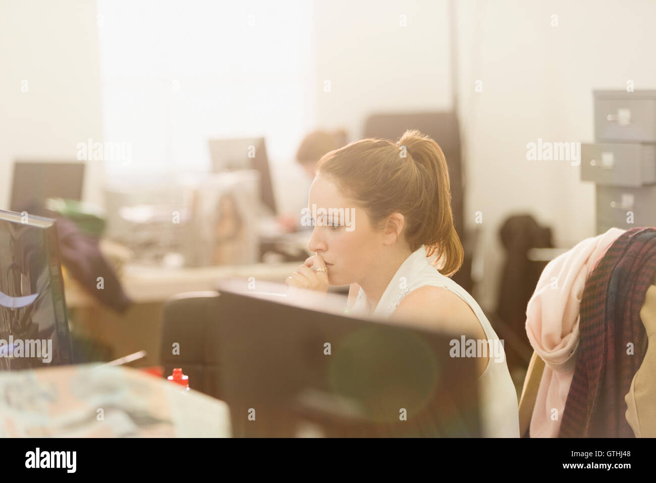 Focused businesswoman working at computer in office Stock Photo - Alamy