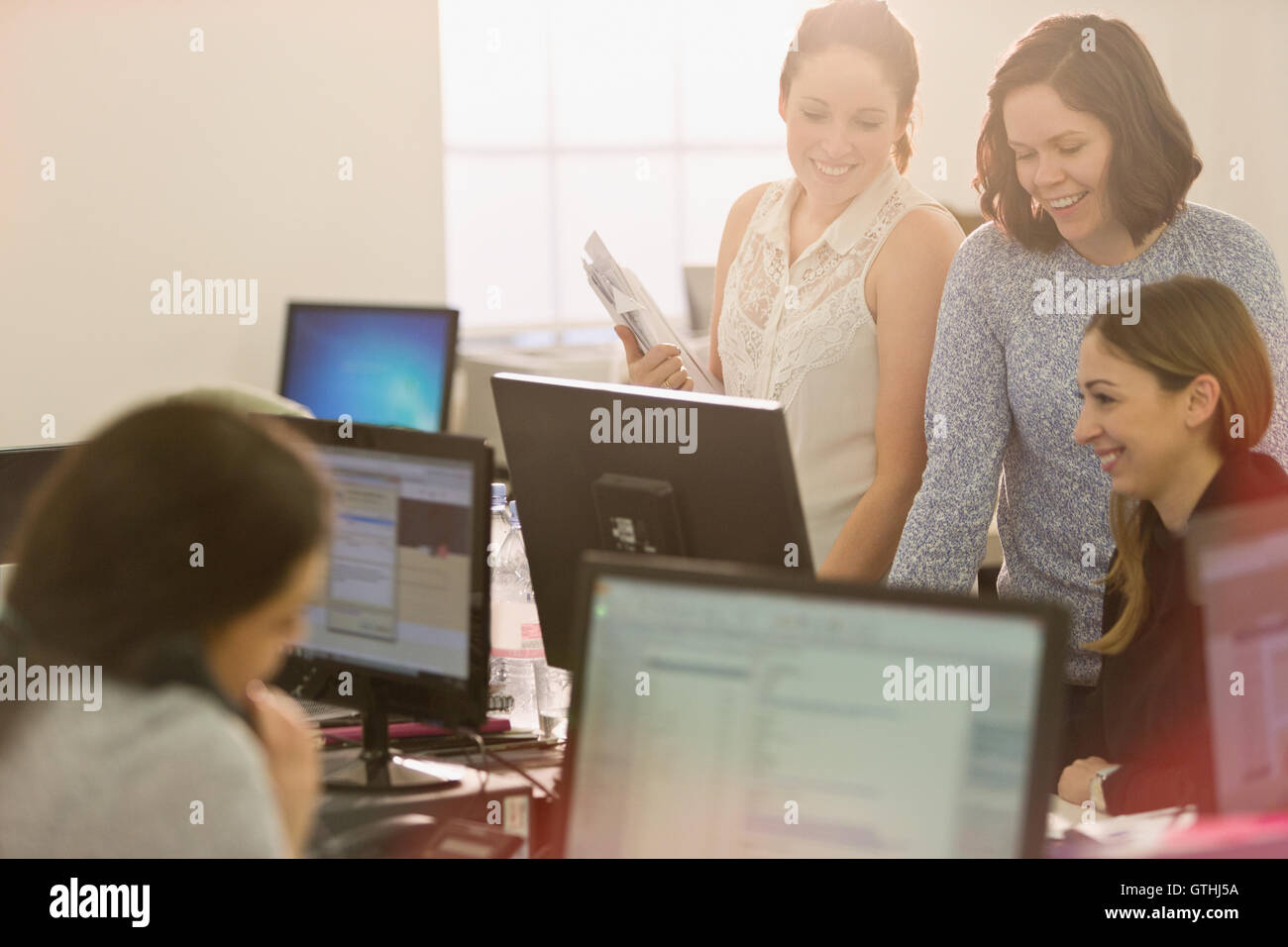 Businesswomen meeting at computer in office Stock Photo - Alamy