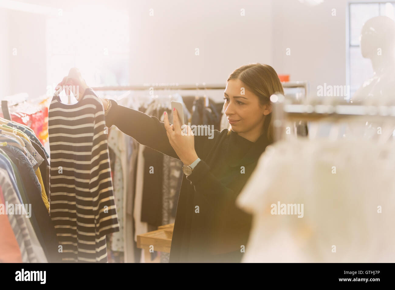 Person in striped shirt holding hi-res stock photography and images - Alamy