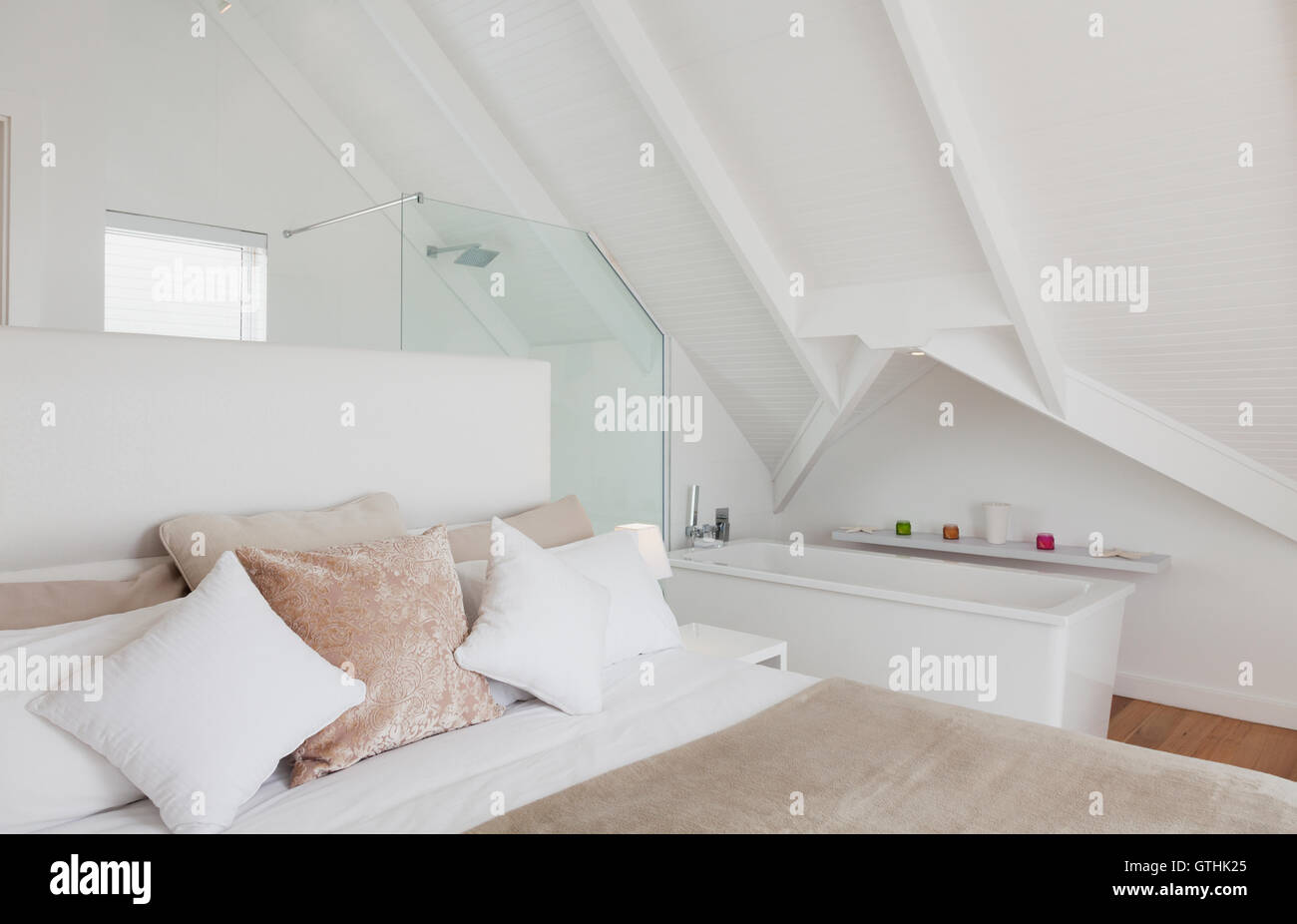 Vaulted ceiling over bedroom with en suite bathroom Stock Photo - Alamy
