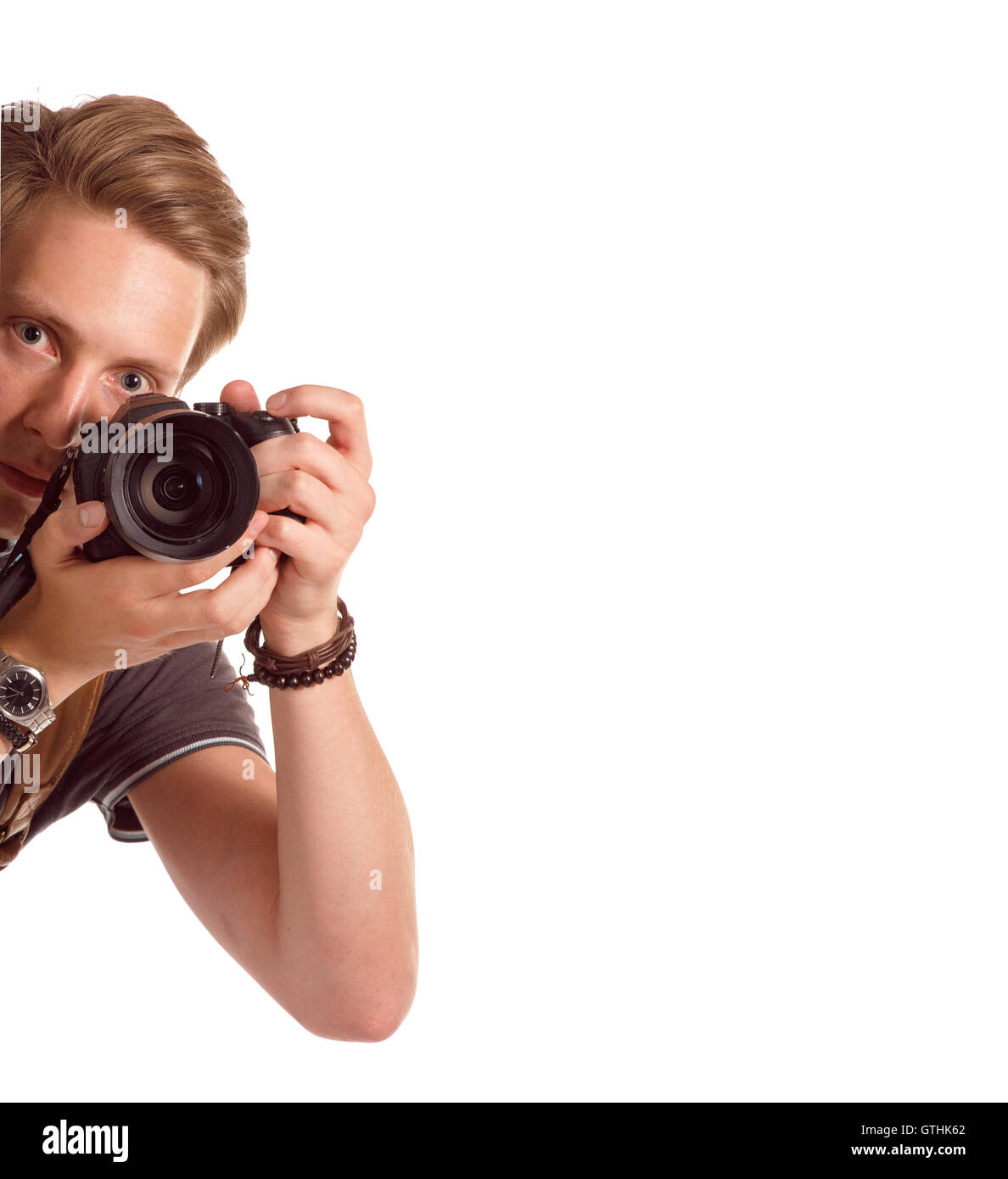 Closeup portrait of a young man taking a picture from corner over white ...