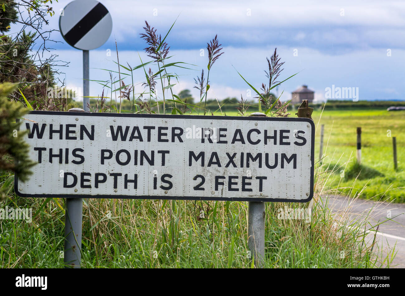 Tidal flood warning sign on the road into Bowness-on Solway, Cumbria ...