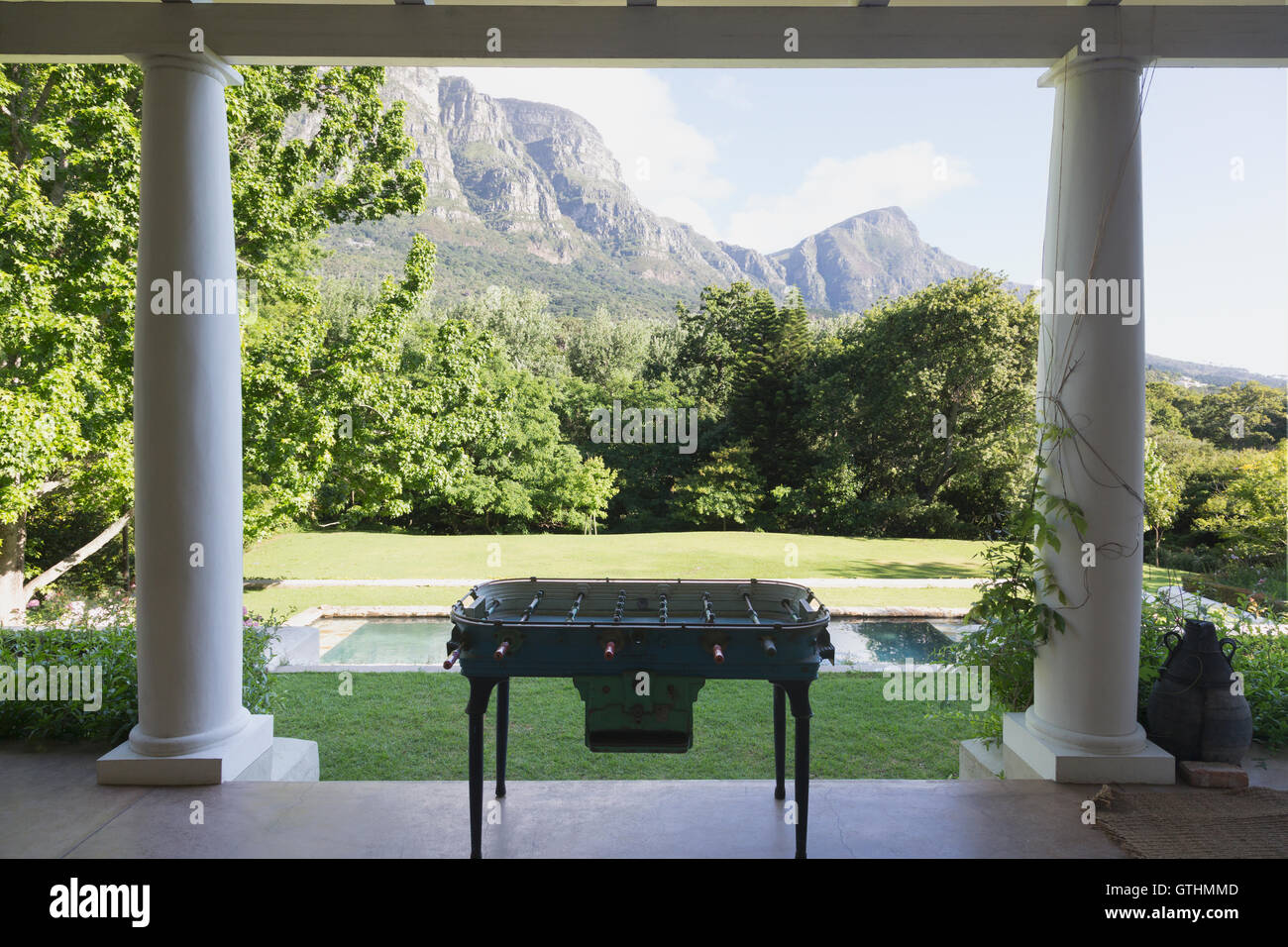 Foosball table on luxury patio overlooking mountains Stock Photo - Alamy