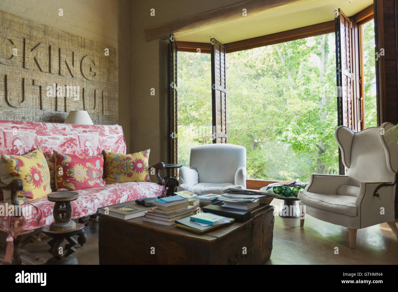 Books on trunk in home showcase living room Stock Photo - Alamy