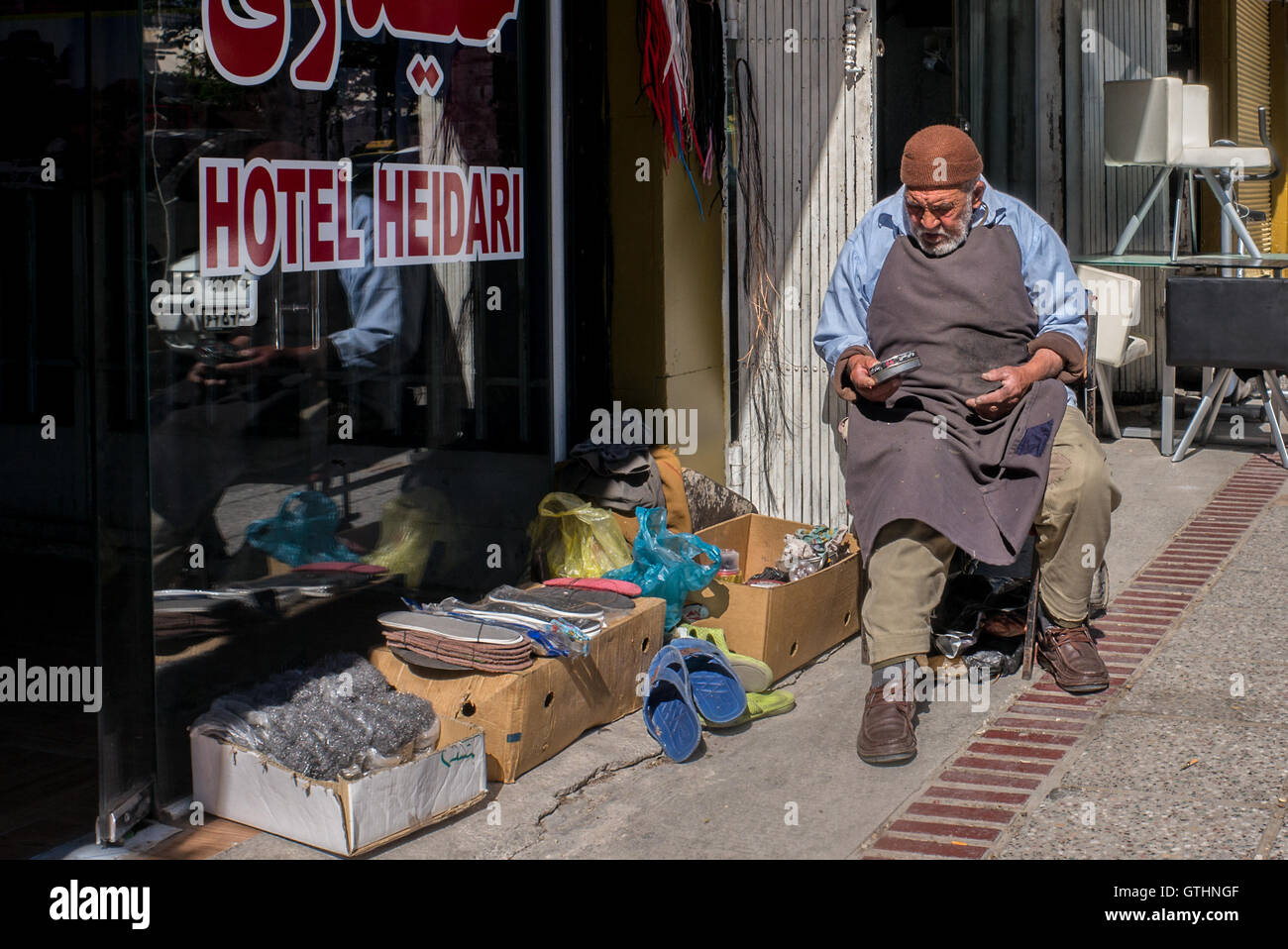 Shoe repair man on street hi-res stock photography and images - Alamy