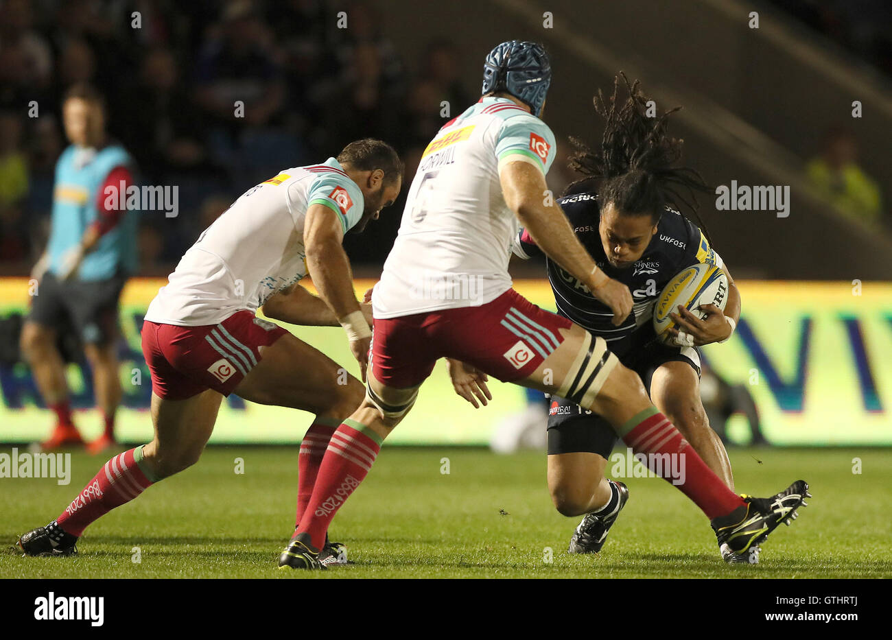Sale Sharks' TJ Ioane is tackled by Harlequins' Jamie Roberts (left ...