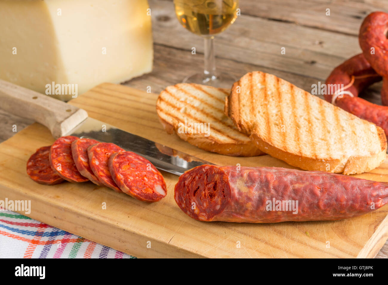 spanish tapa for brunch. Iberian chorizo, mature cheese, toasts, oil ...