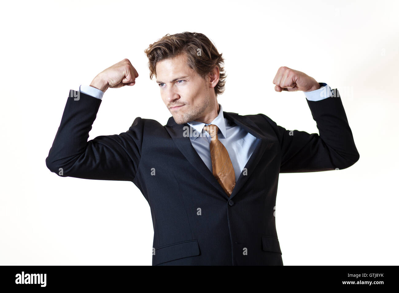 Strong business man flexing muscle hi-res stock photography and images ...