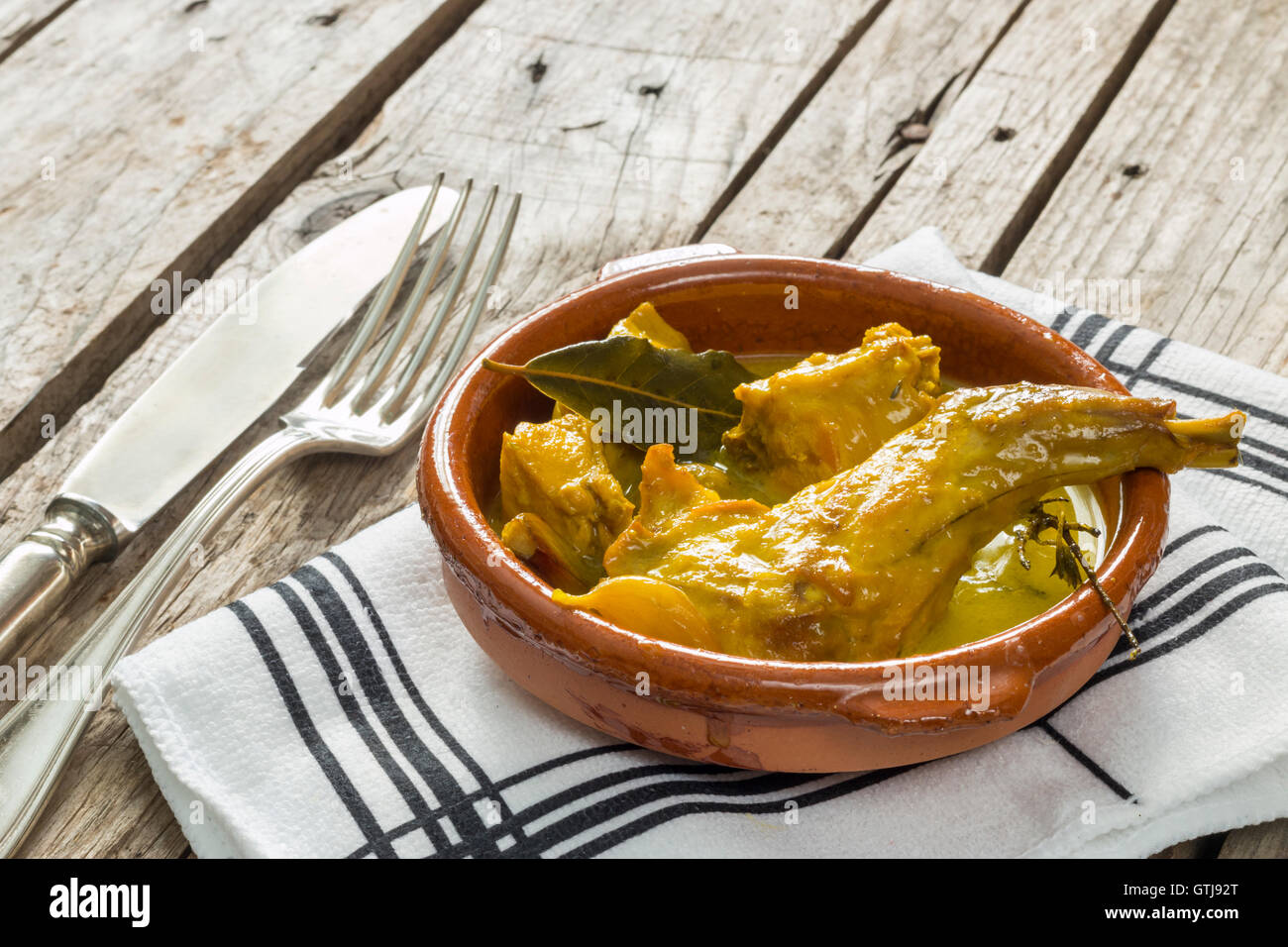 Rustic portion of rabbit with sauce Stock Photo - Alamy